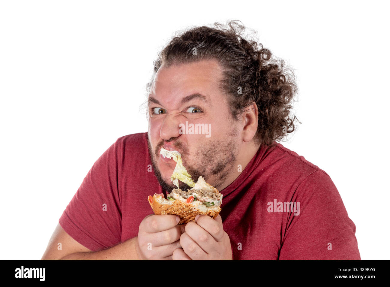 Funny fat man eating hamburger. Fast food, unhealty eat Stock Photo - Alamy