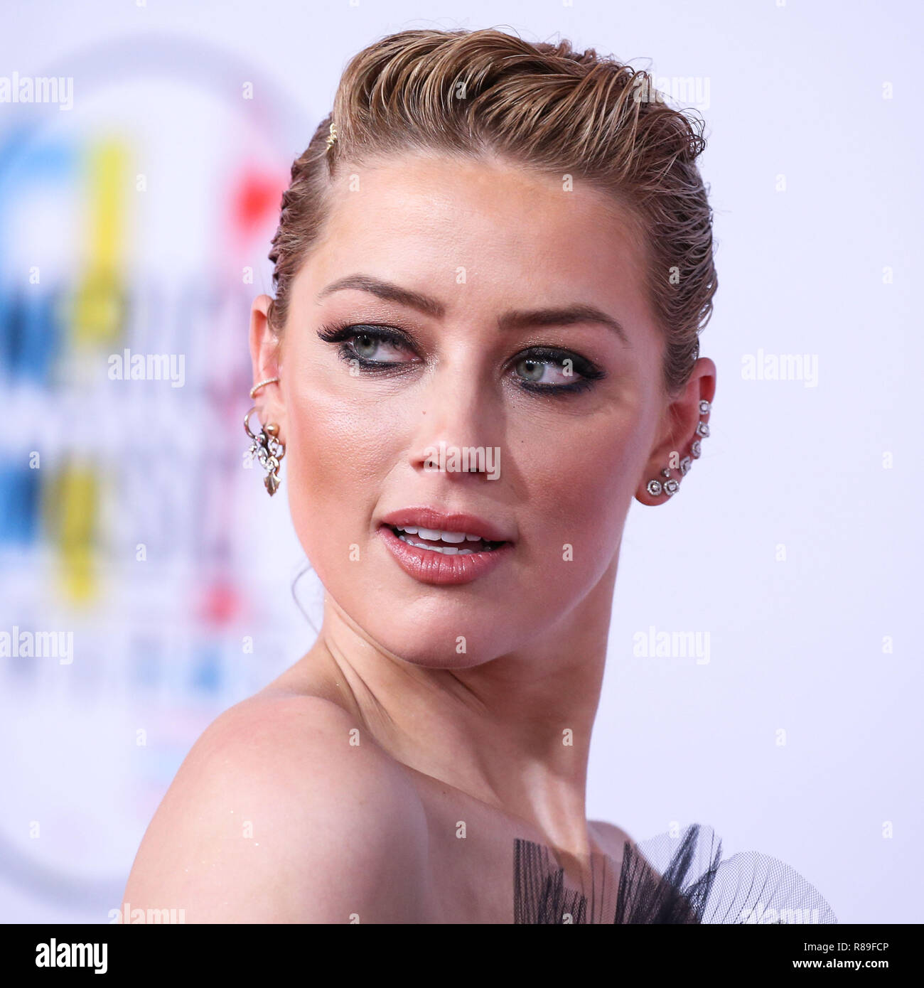 LOS ANGELES, CA, USA - OCTOBER 09: Actress Amber Heard wearing a Ralph ...