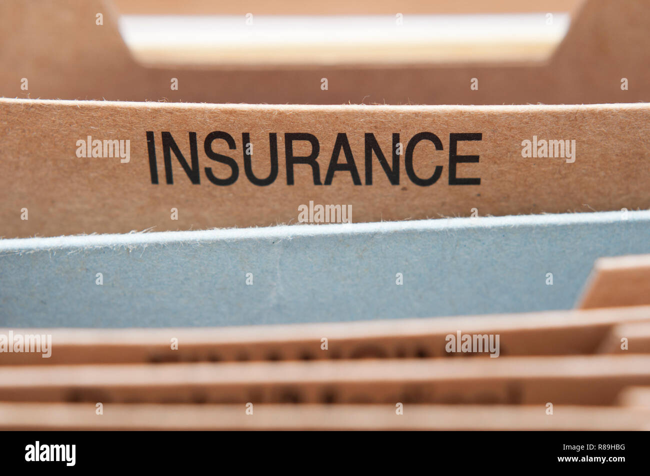 Insurance section tab in folding file Stock Photo - Alamy