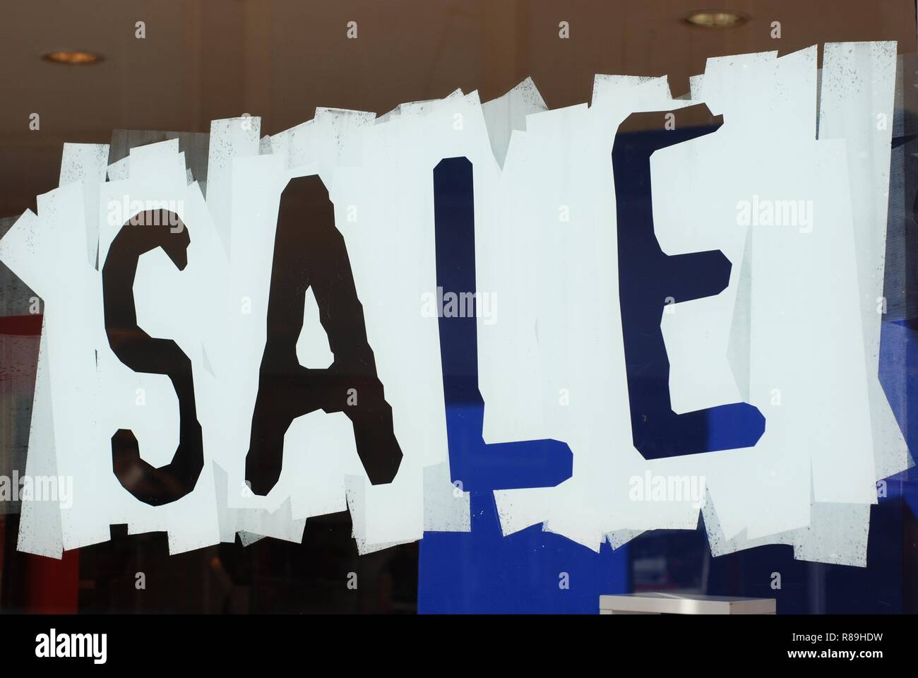Sale sign in shop window Stock Photo - Alamy