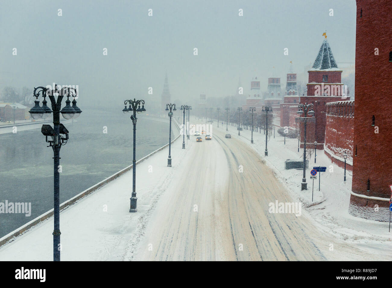Snowstorm in the city of Moscow, the road near the walls of the Kremlin ...