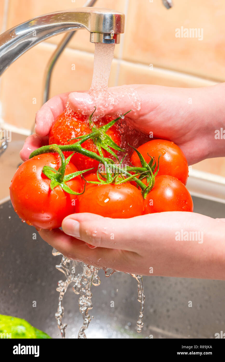 Washing tomato in running water hi-res stock photography and images - Alamy