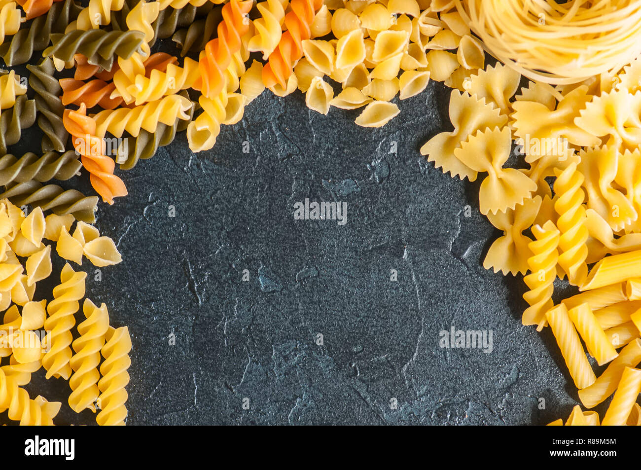 Variety of types of Italian pasta background. Set of raw dry pasta on a ...