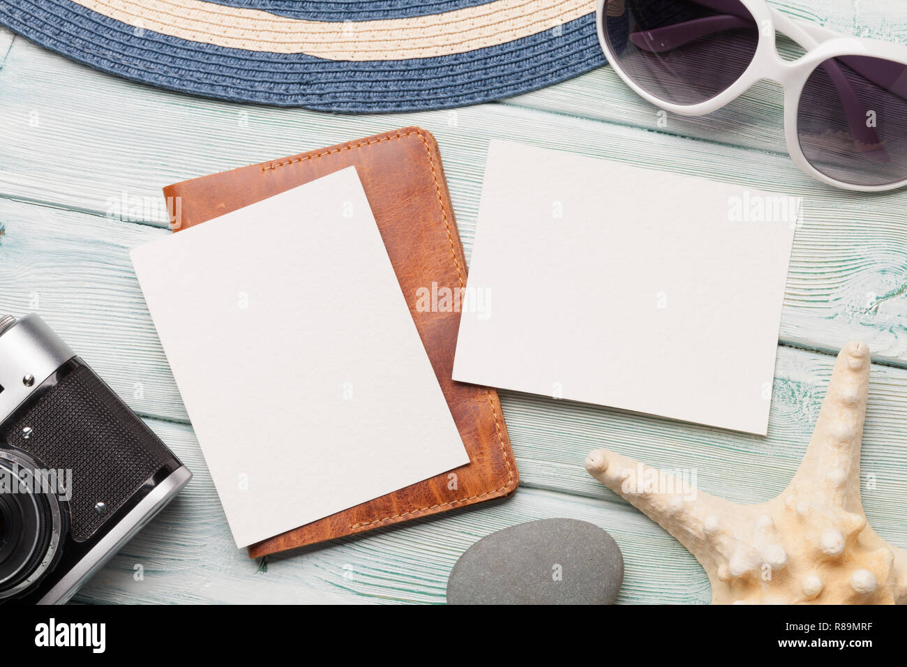 Travel vacation table concept with camera, passport and photo frames on ...