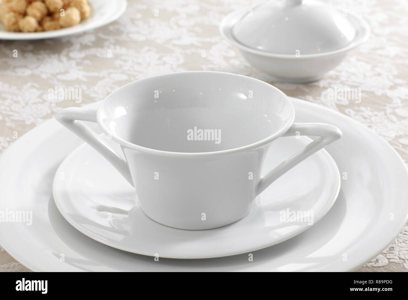 Ceramic tableware on white table Stock Photo - Alamy