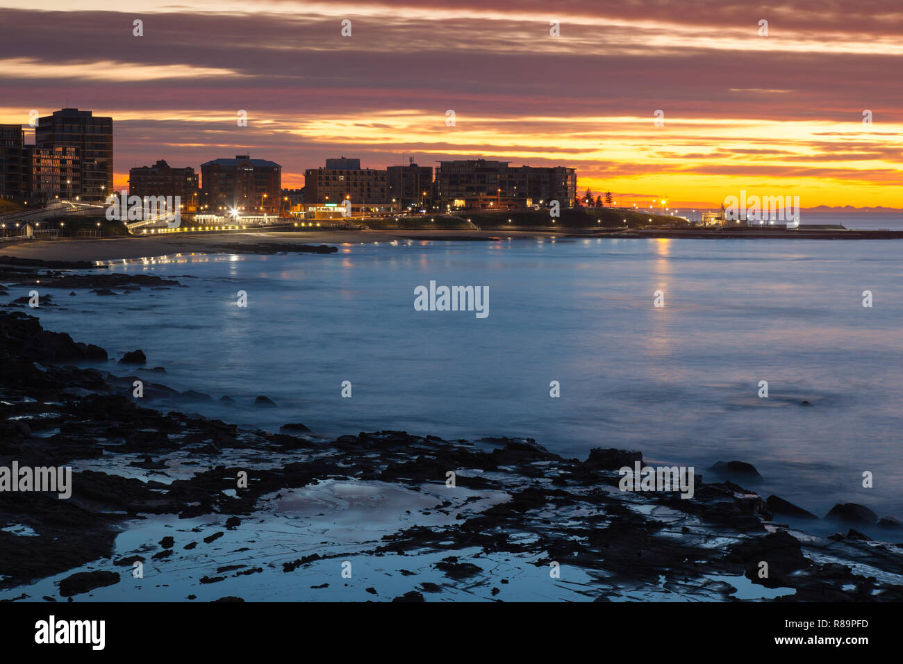 Sunrise at Newcastle beach looking north towards the ocena baths ...