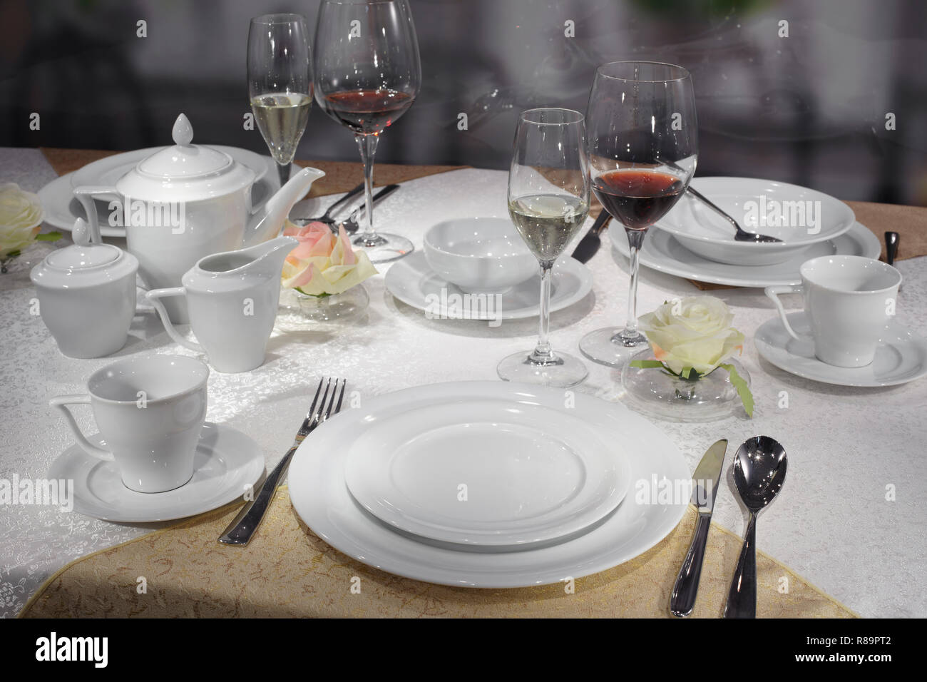 Ceramic tableware on white table Stock Photo - Alamy