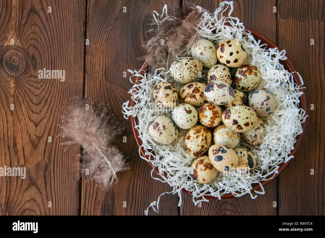 Fresh quail eggs in a plate on a wooden background. Rustic style Stock ...
