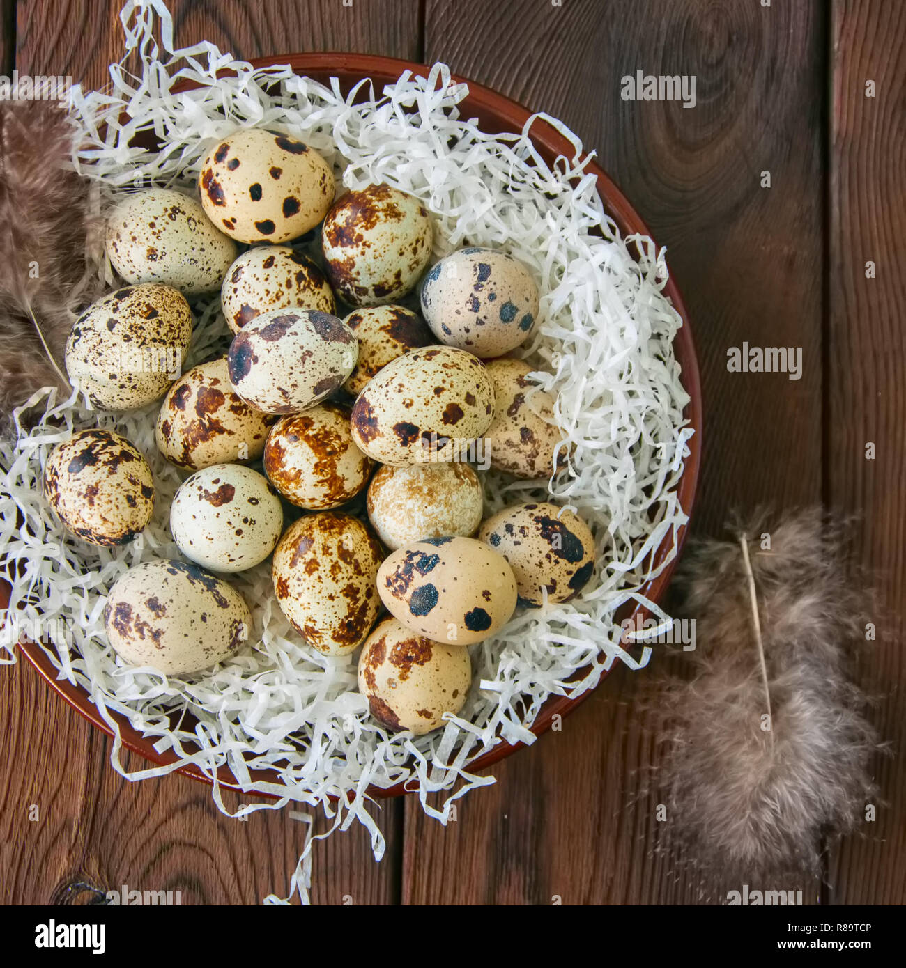 Fresh quail eggs in a plate on a wooden background. Rustic style Stock ...