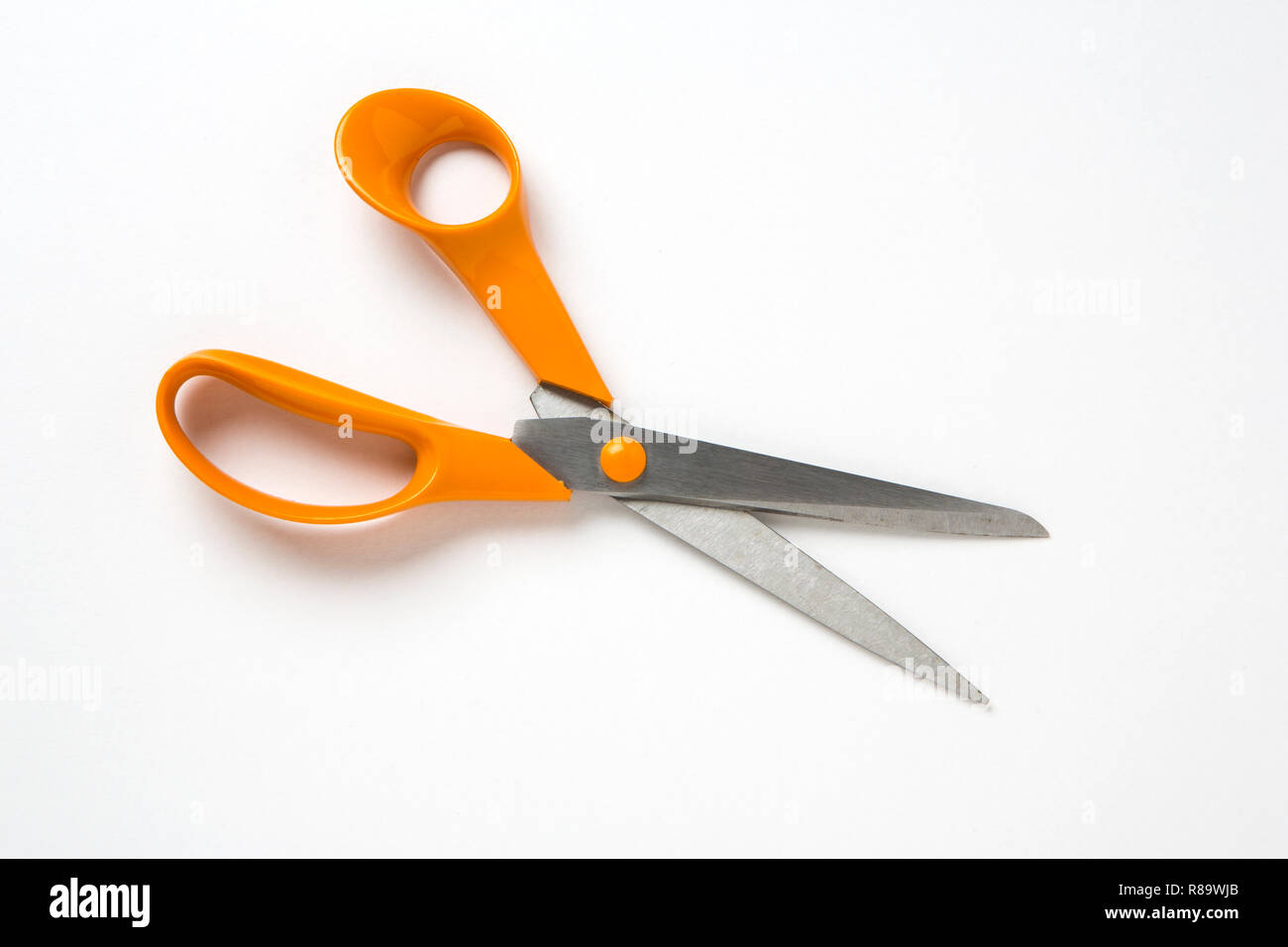 Orange handled kitchen scissors Stock Photo - Alamy