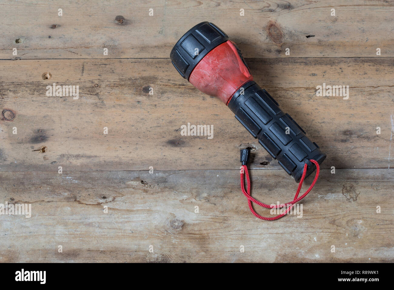 An old red and black rubber torch Stock Photo - Alamy