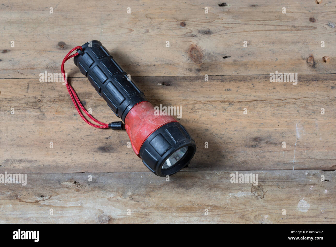 An old red and black rubber torch Stock Photo - Alamy