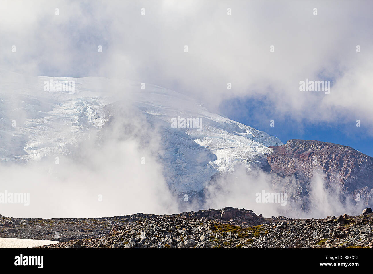rocky lookout in front of mountain glacial field Stock Photo - Alamy