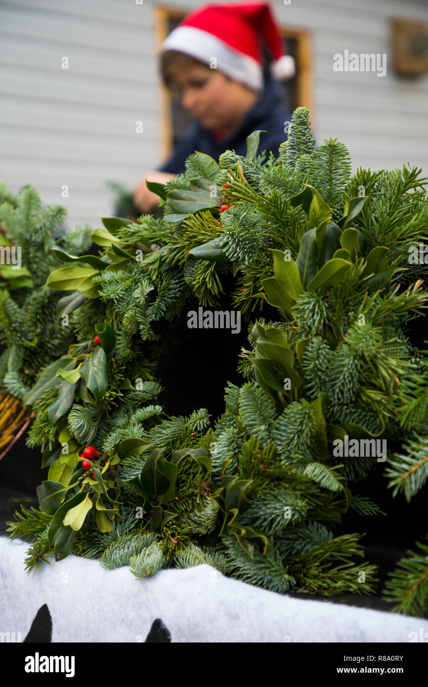 A Christmas wreath made with Ilex and Spruce foliage Stock Photo - Alamy