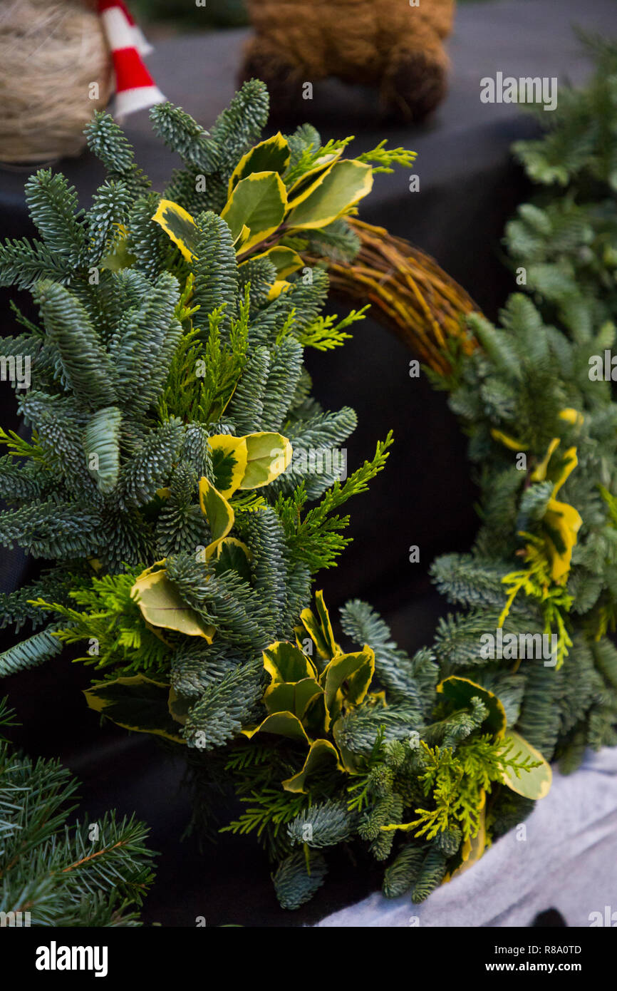 A Christmas wreath made with Ilex and Spruce foliage Stock Photo - Alamy