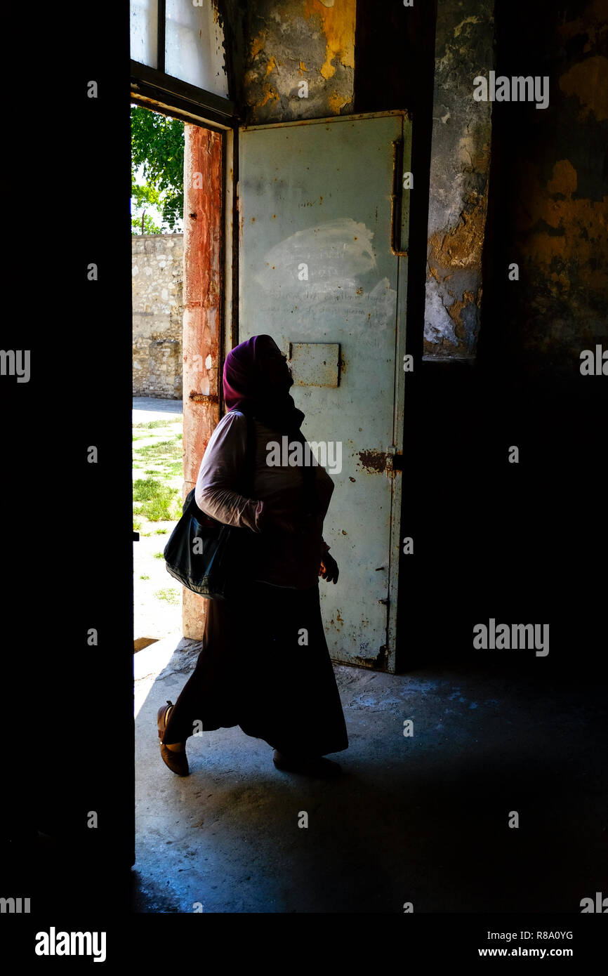 Woman entering the prison Stock Photo - Alamy