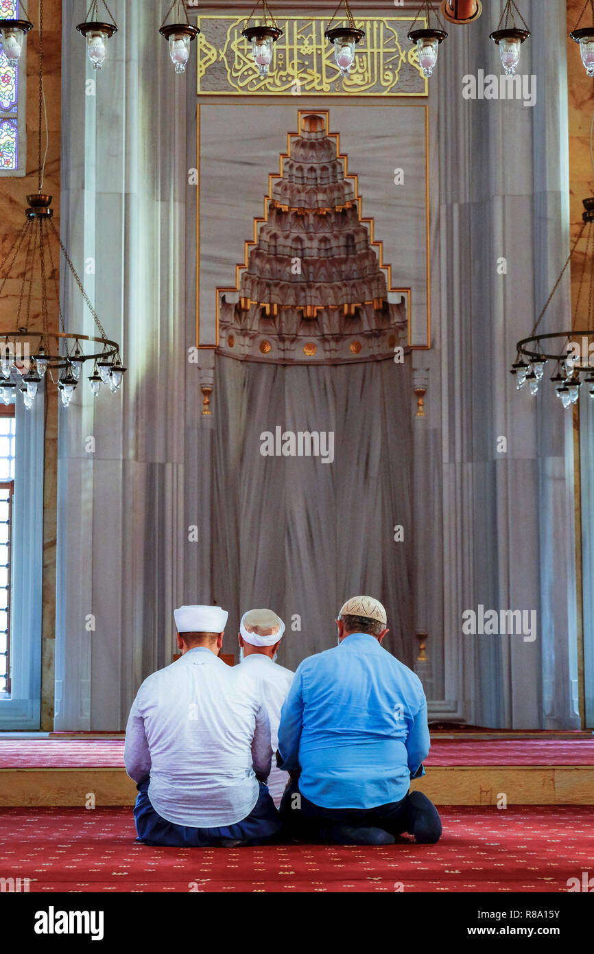 Three man inside a mosque Stock Photo - Alamy