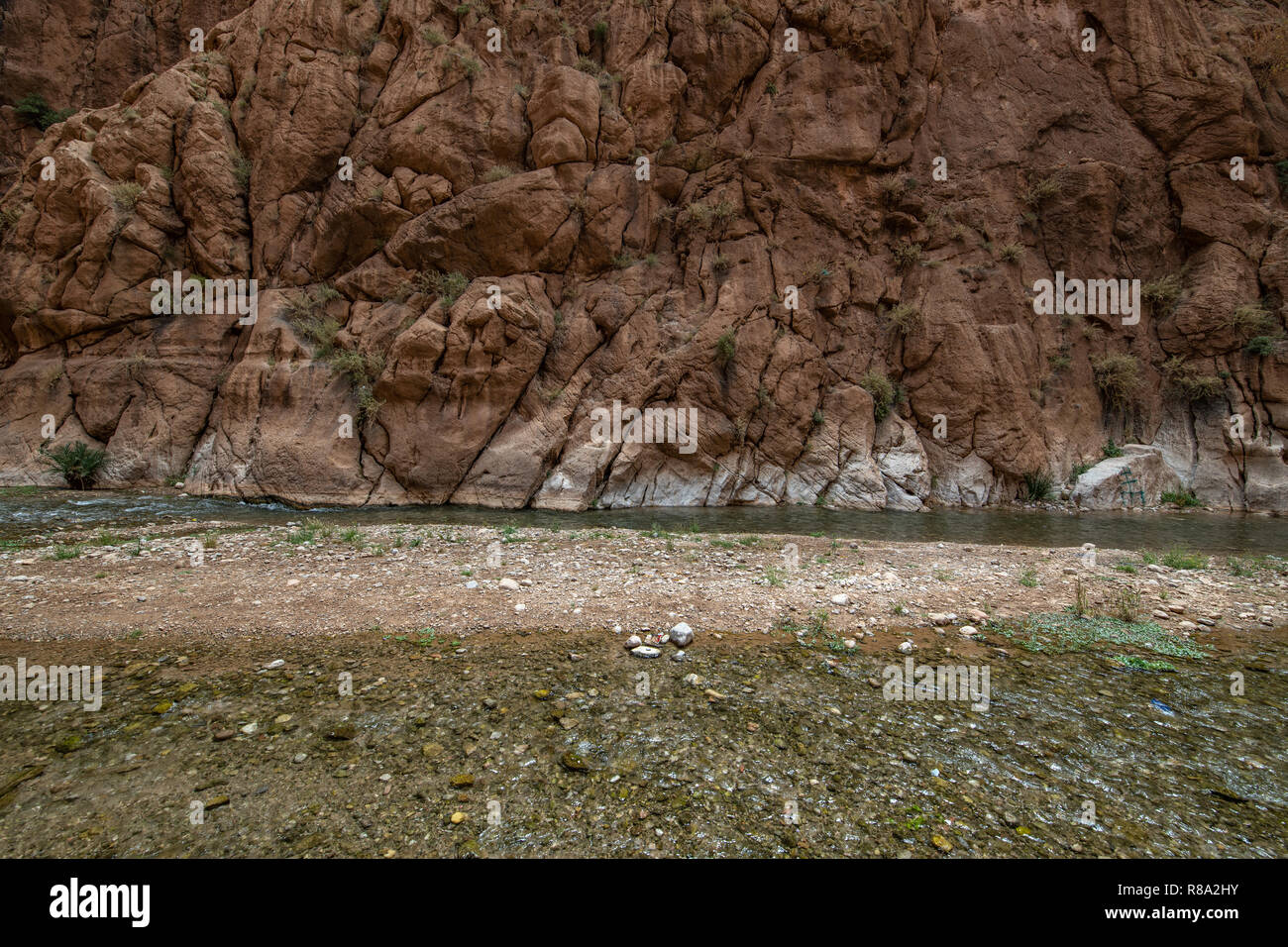 Water flows down the limestone canyons of the Todra Gorge, Tinghir ...