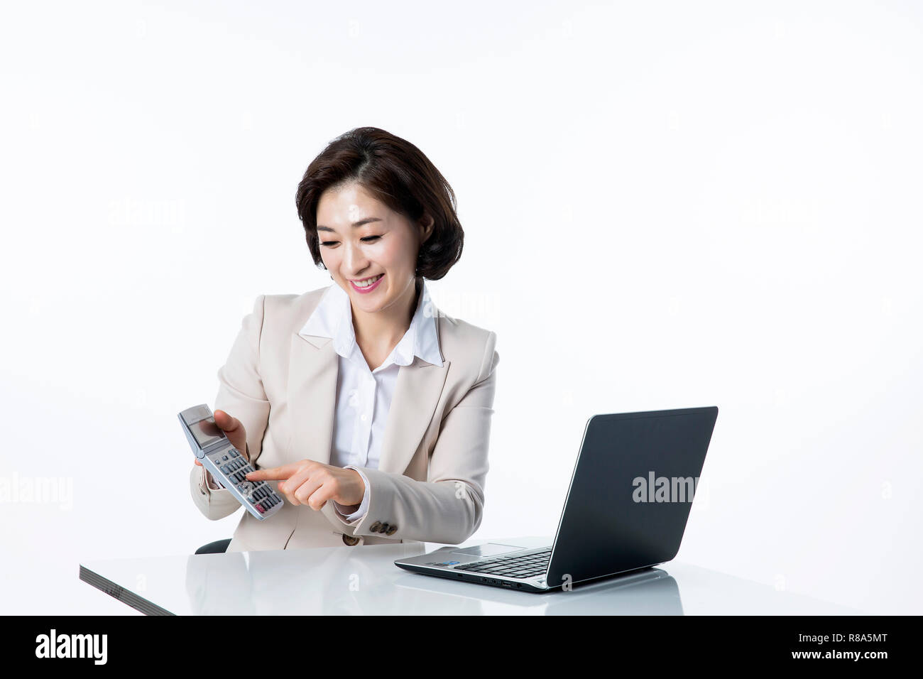 Middleaged woman with computer hi-res stock photography and images - Alamy