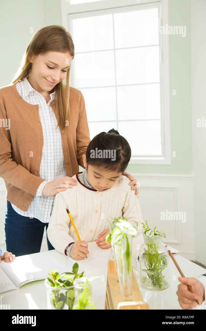 Young Student In Biology Class With A Female Teacher Stock Photo - Alamy