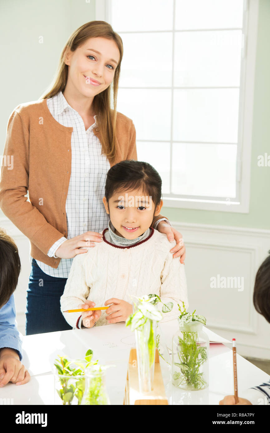 Young Student In Biology Class With A Female Teacher Stock Photo - Alamy