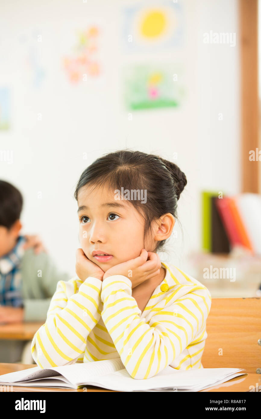 Young Student Looking Lost In Class Stock Photo - Alamy