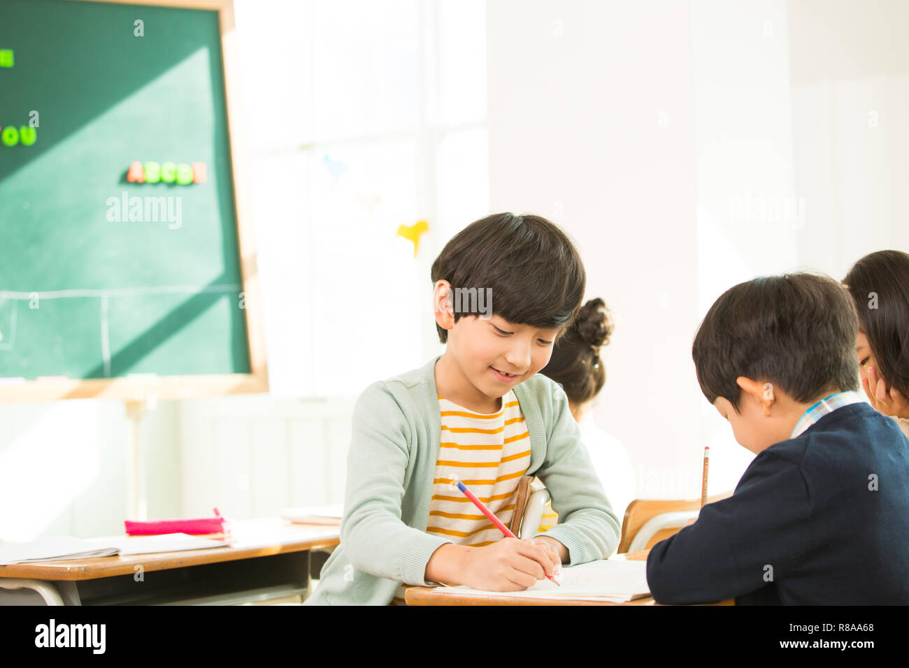 Two Young Male Students In Class Stock Photo - Alamy
