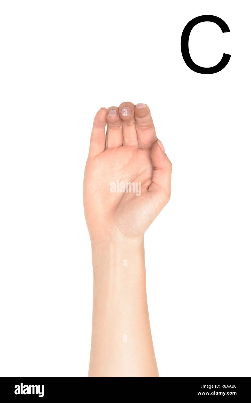 cropped view of female hand showing latin letter - C, sign language ...