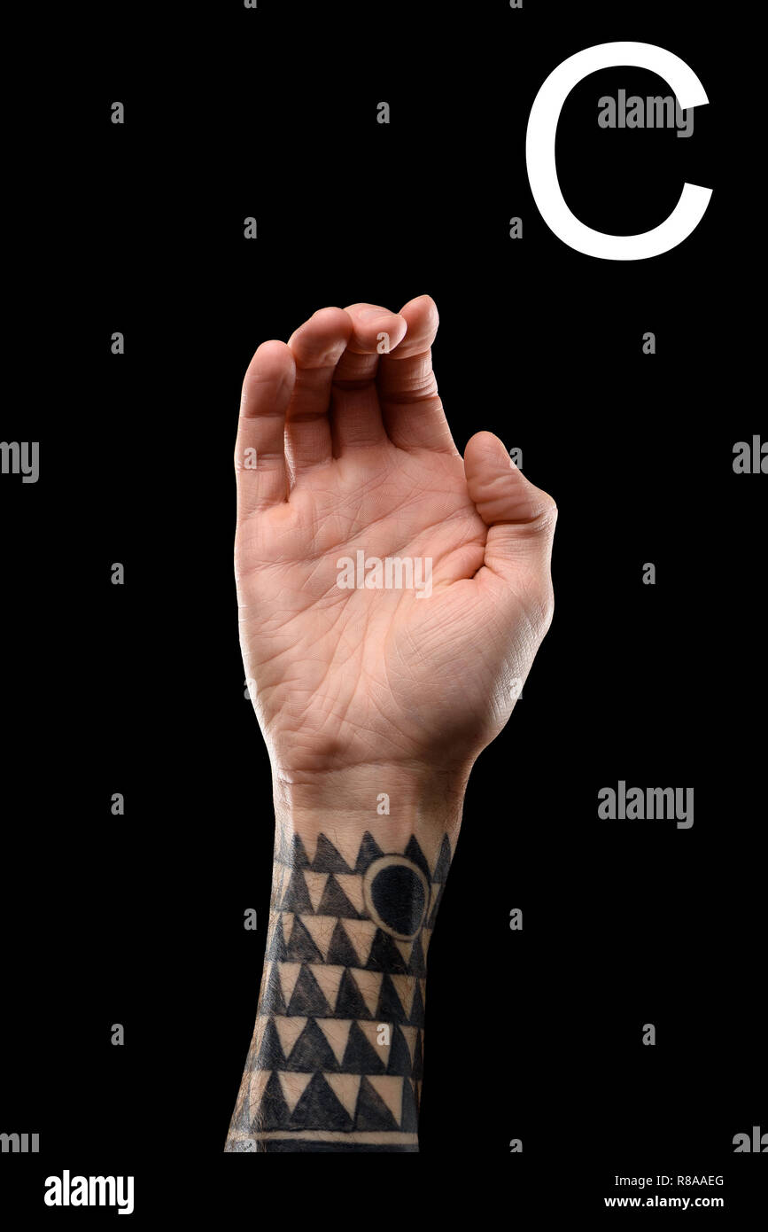 tattooed hand showing latin letter - C, sign language, isolated on ...