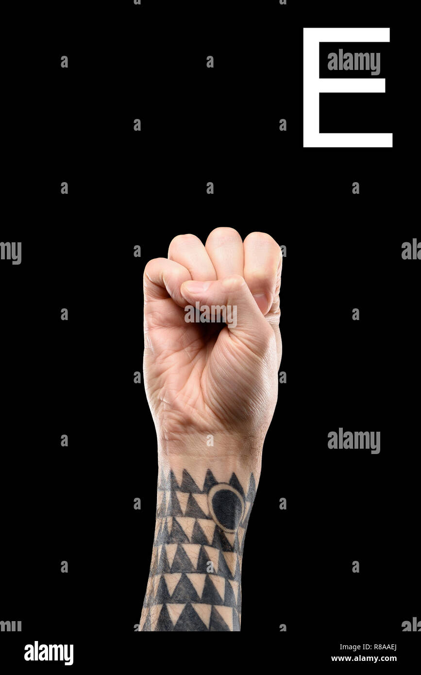 tattooed male hand showing latin letter - E, sign language, isolated on ...