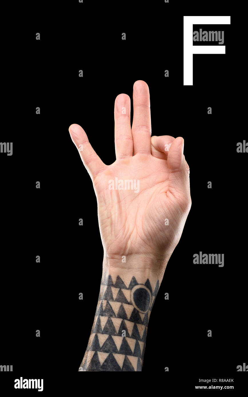 tattooed male hand showing latin letter - F, sign language, isolated on ...
