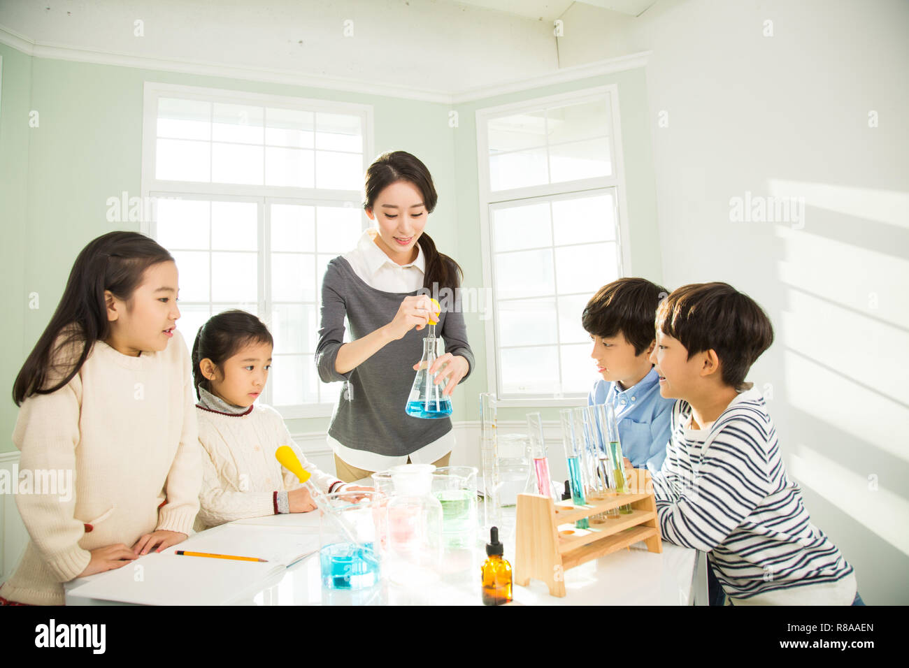 Young Students In Science Class With A Female Teacher Stock Photo - Alamy