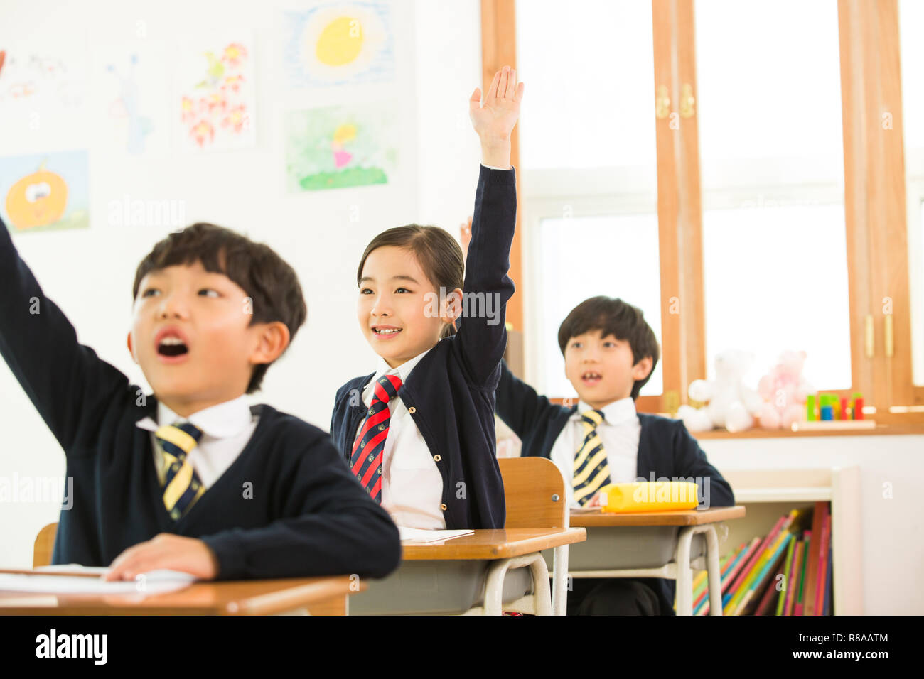 Young Students In Class Wearing Uniforms Stock Photo - Alamy