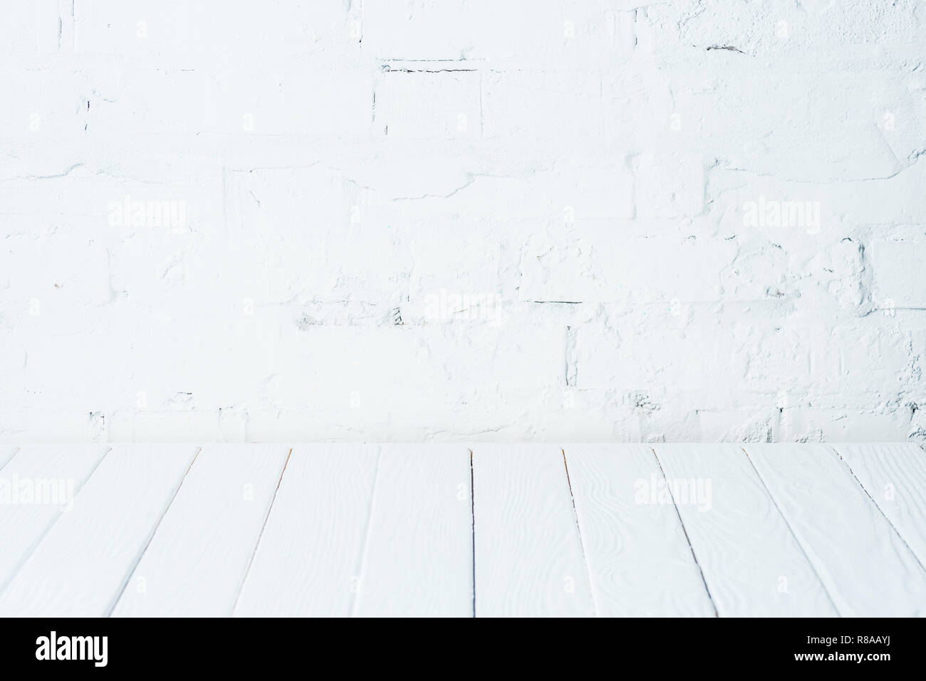 white brick wall and rustic wooden table Stock Photo - Alamy