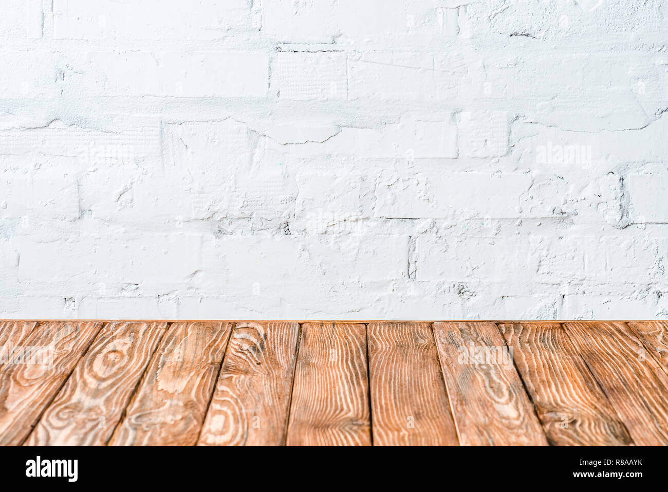white brick wall and rustic wooden table Stock Photo - Alamy
