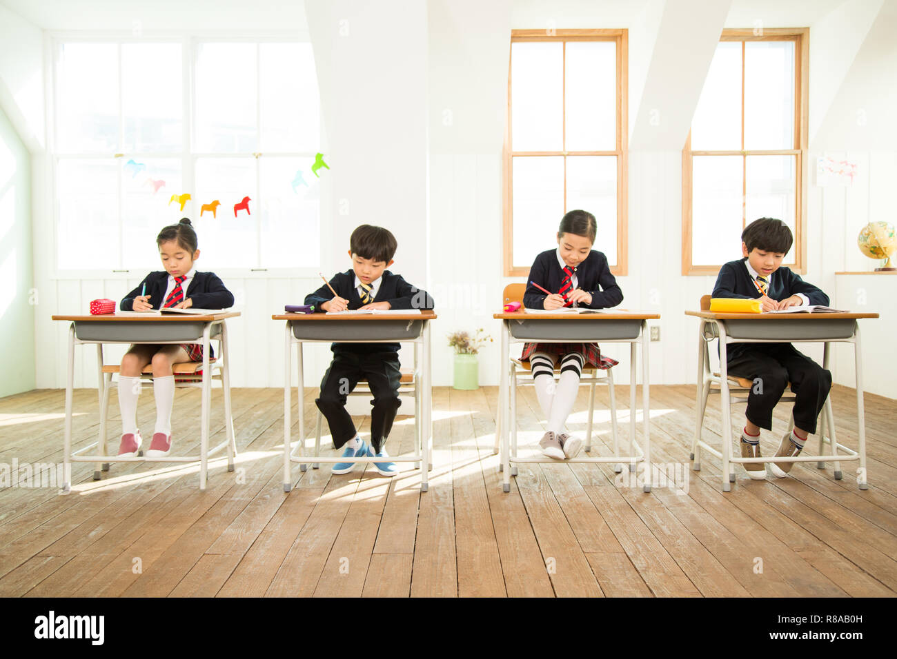 Young students wearing uniforms hi-res stock photography and images - Alamy