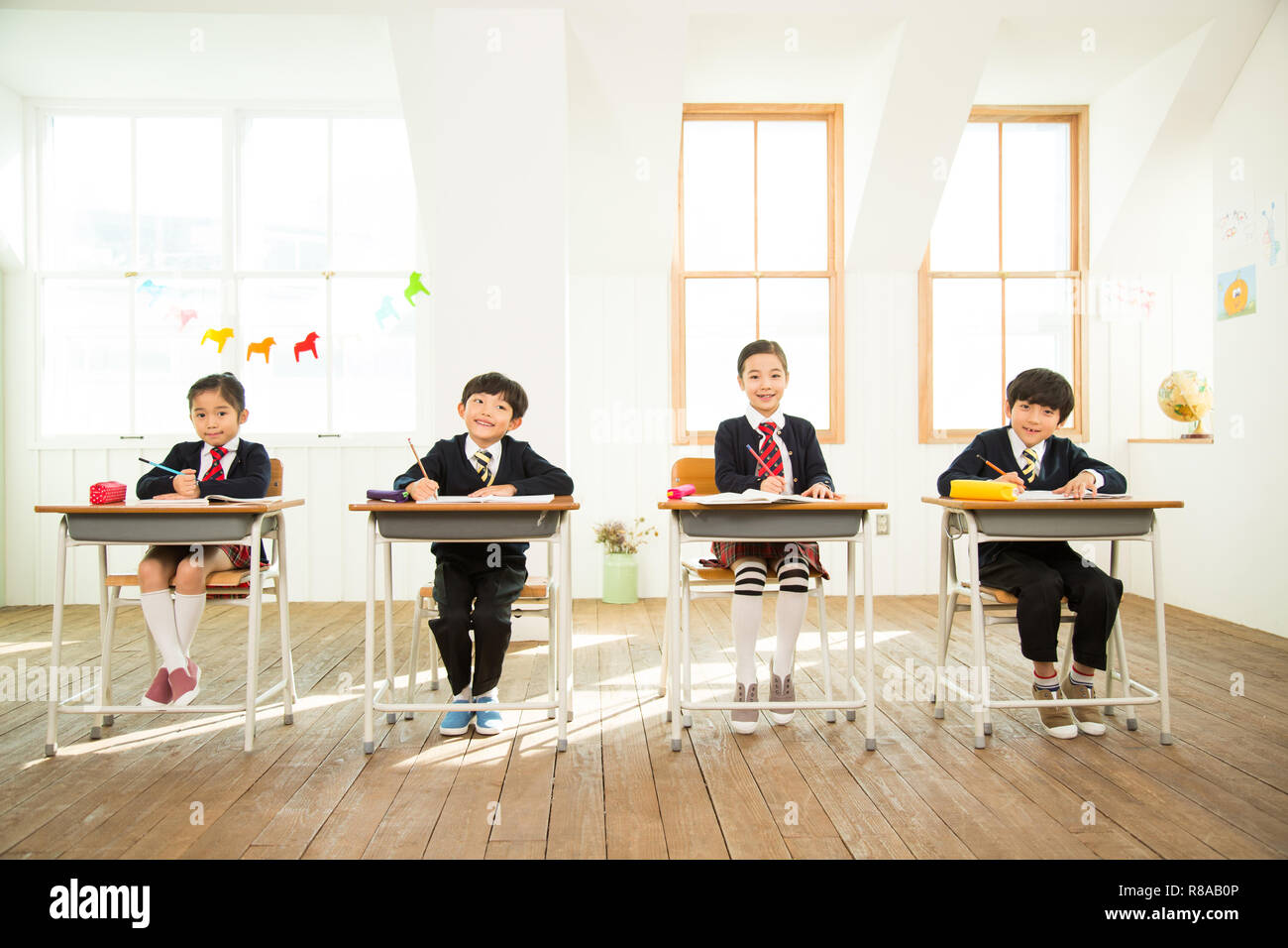 Young Students In Class Wearing Uniforms Stock Photo - Alamy