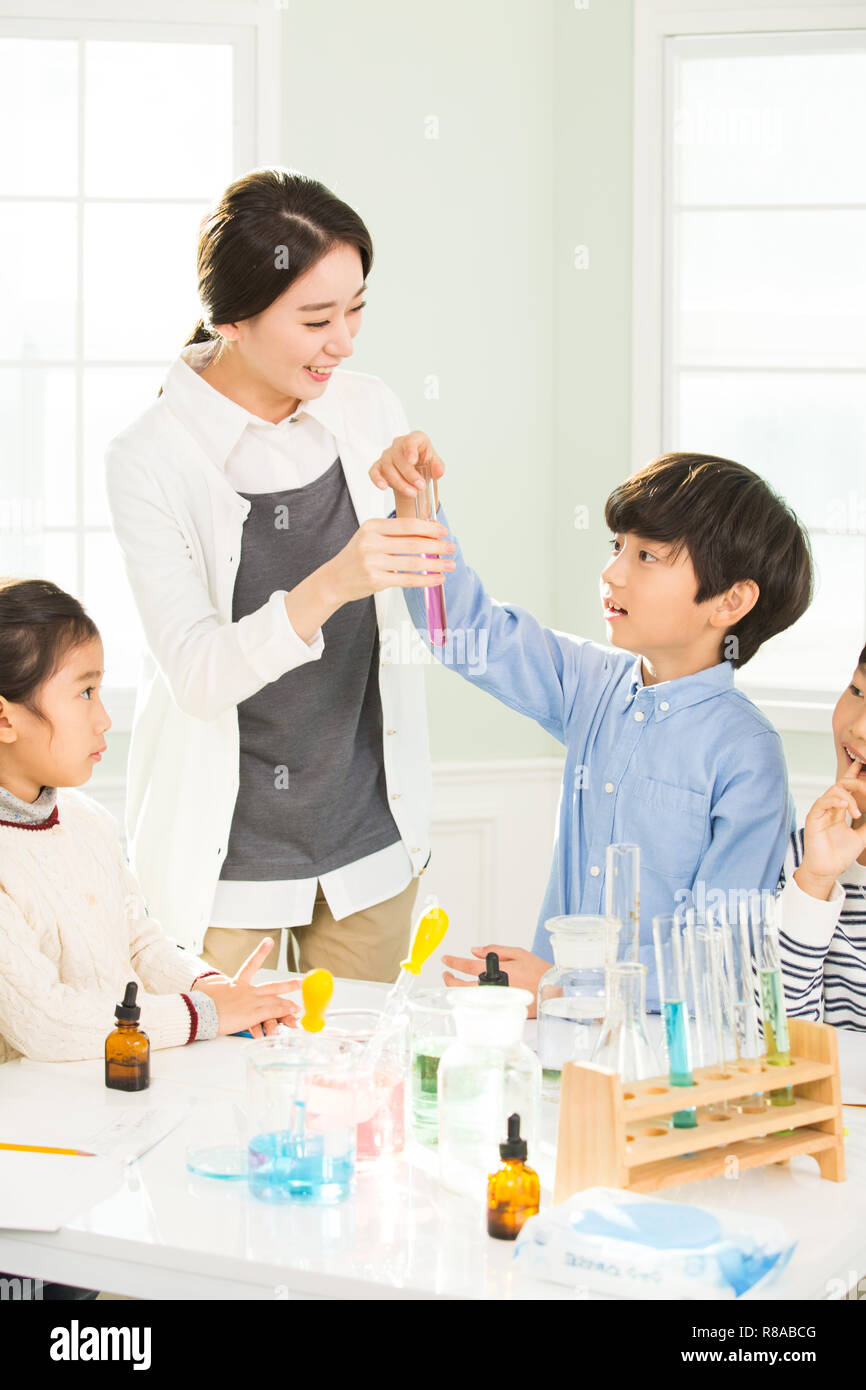 Young Students In Science Class With A Female Teacher Stock Photo - Alamy