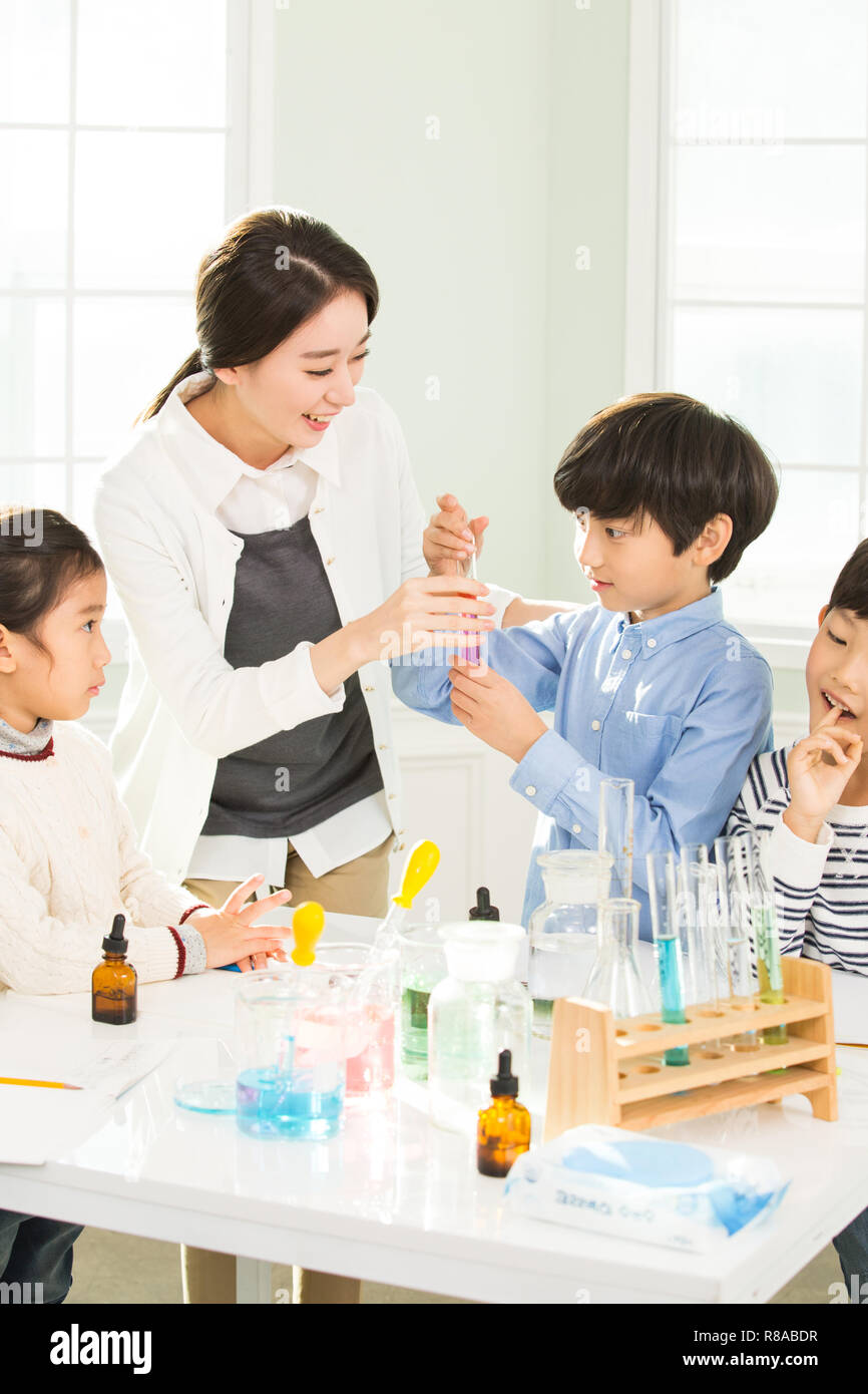 Young Students In Science Class With A Female Teacher Stock Photo - Alamy