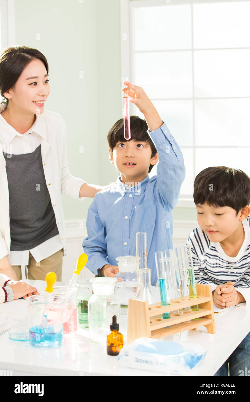 Young Students In Science Class With A Female Teacher Stock Photo - Alamy
