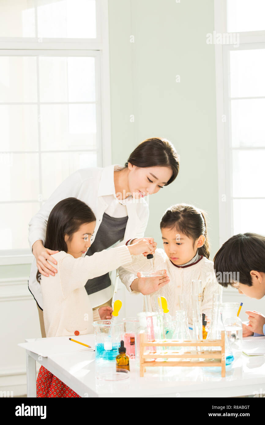 Young Students In Science Class With A Female Teacher Stock Photo - Alamy