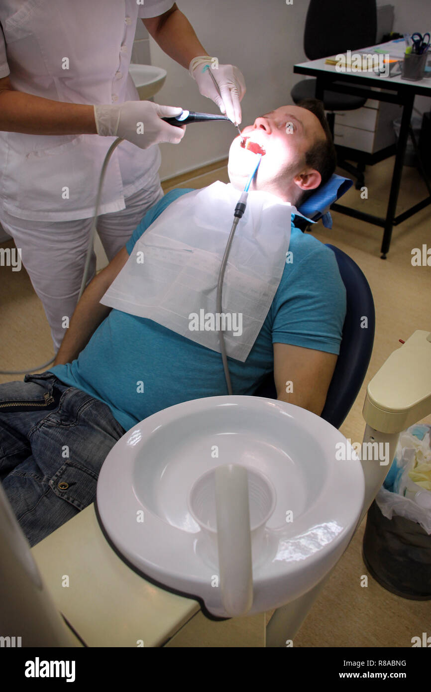 Dental tool for rinsing teeth. Teeth cleaning, dental hygiene. Dentist ...