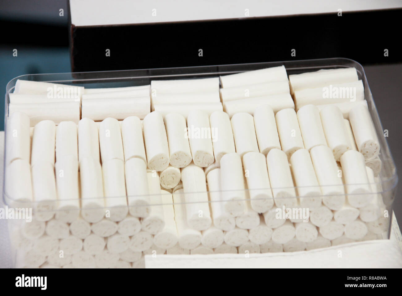 Dental professional cotton wool rolls in holder. Dental equipment for ...