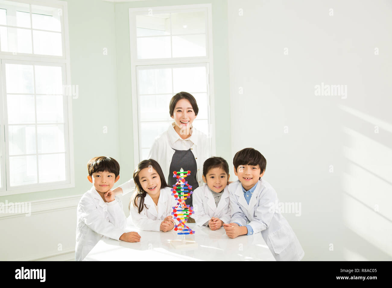 Young Students Learning About DNA With A Female Teacher Stock Photo - Alamy