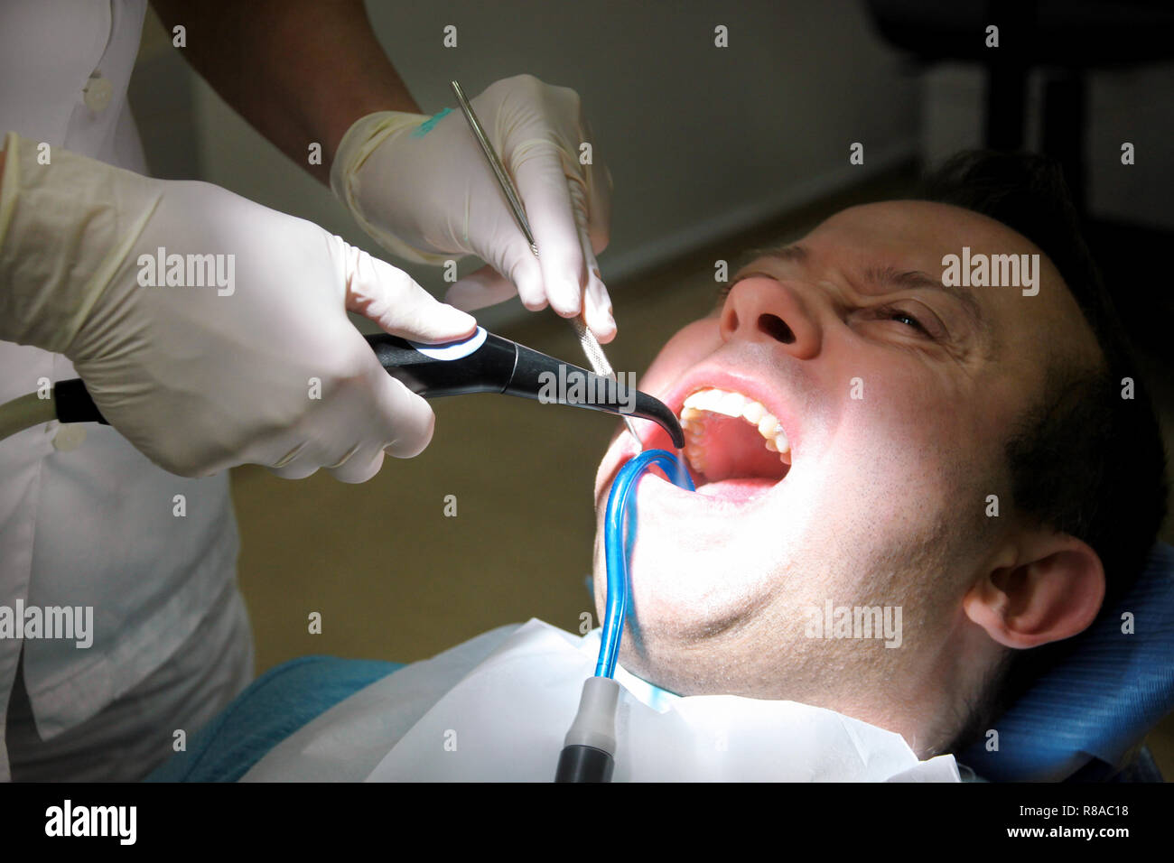 Dental tool for rinsing teeth. Teeth cleaning, dental hygiene. Dentist ...