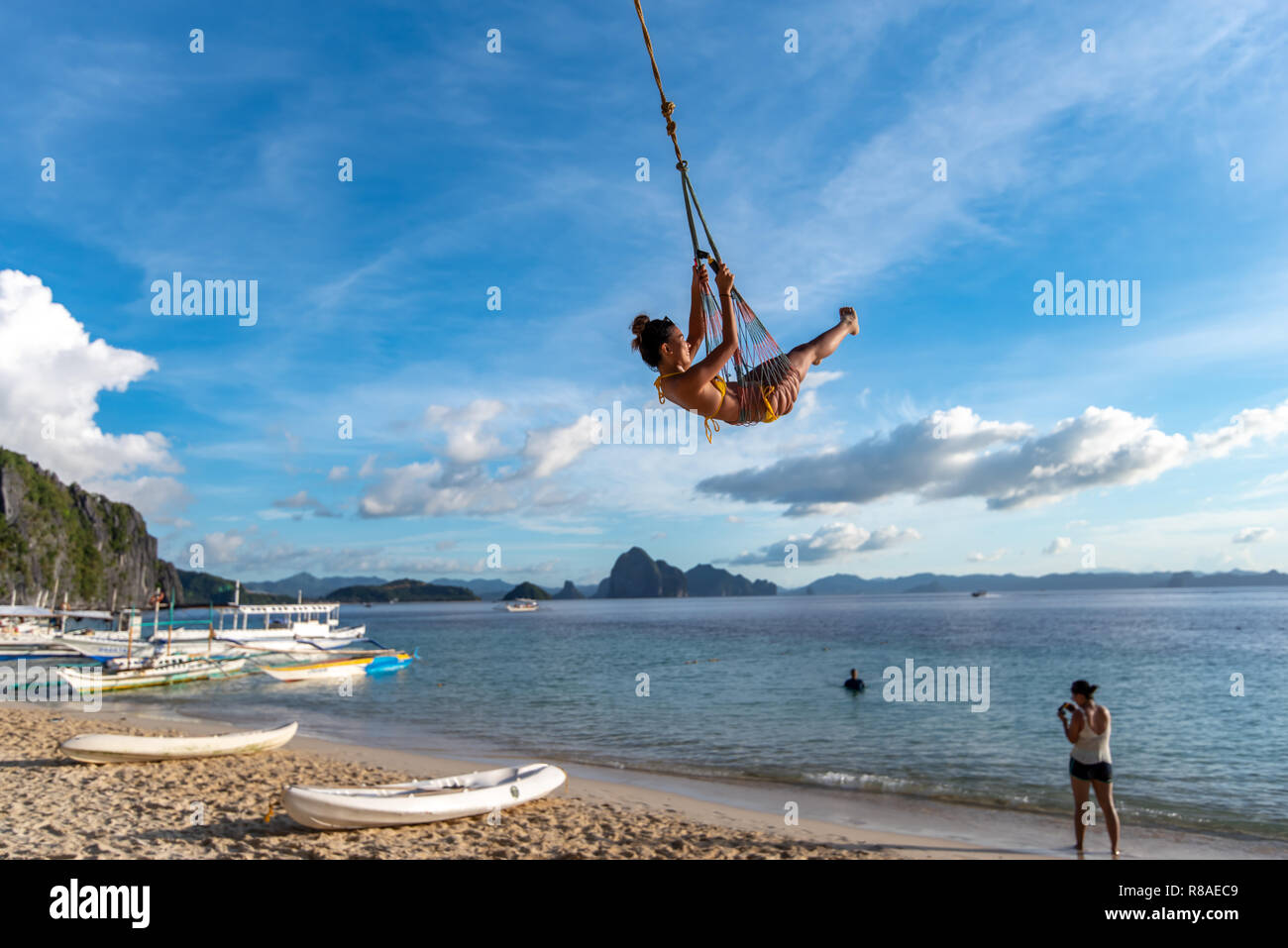 Nov 18,2018 A woman on a swing at the 7 commandos island beach in a El ...