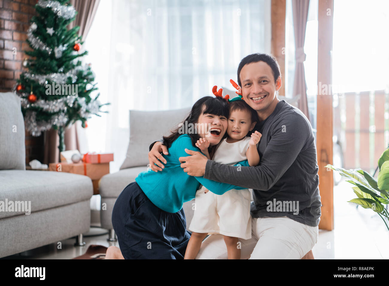 portrait of happy family hugging each other when christmas moment Stock ...