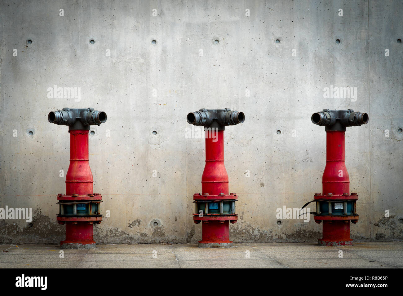 Three fire safety pump on cement floor of concrete building. Deluge ...