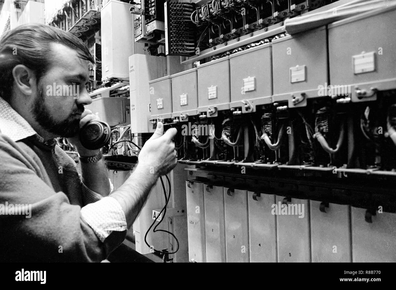 An engineer plugging a butt (test phone) into a selector in a strowger ...