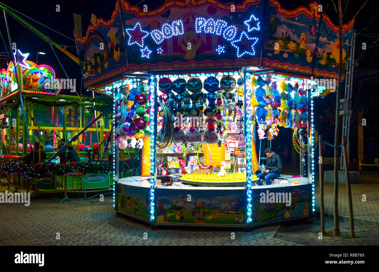 Lighted Christmas game kiosk at night in Seville, Spain Stock Photo - Alamy